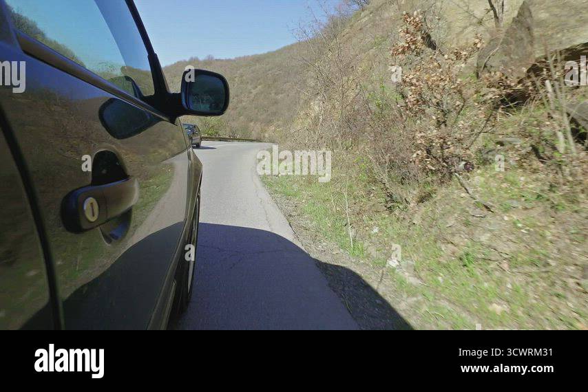 Fast Dangerous Drive of a Car on a Country Road with Rock Slide from ...