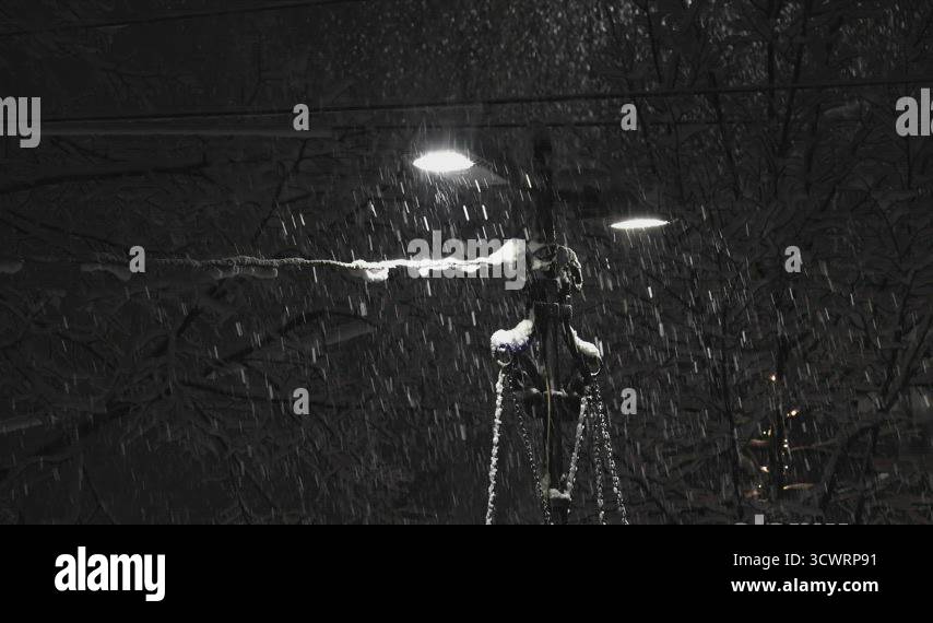 Beautiful winter background scene with city lamp post and snow blizzard ...