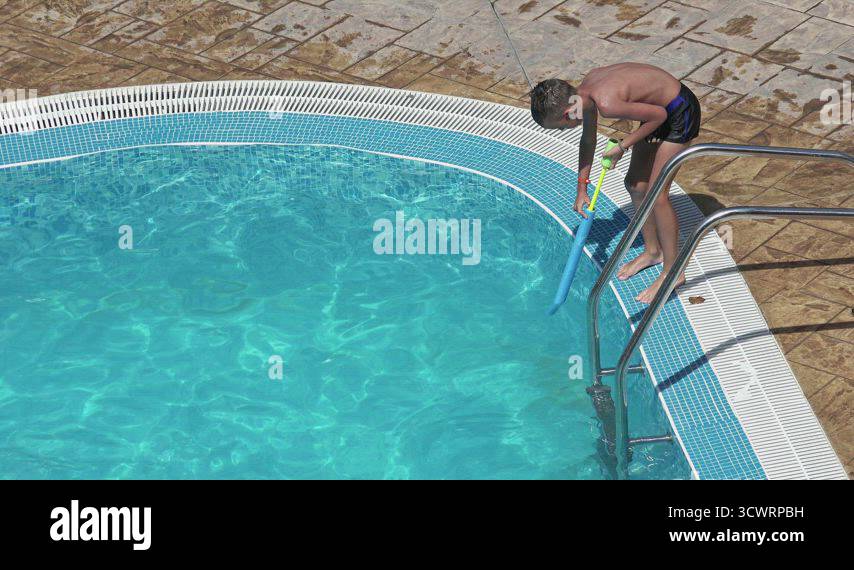 Family pool fun, Little boy shooting with water gun at his father Stock ...