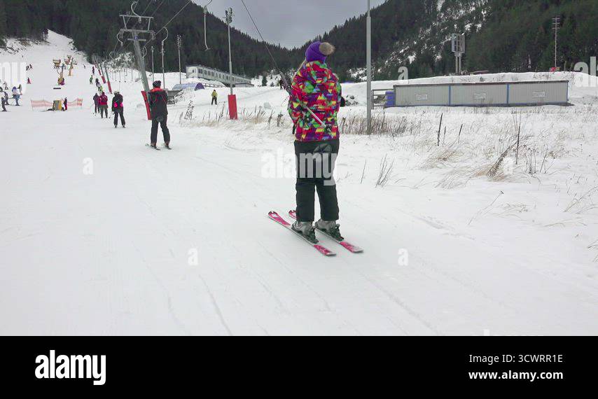 BANSKO, BULGARIA - circa FEB, 2016: Ski lift pulling skiers up the ...