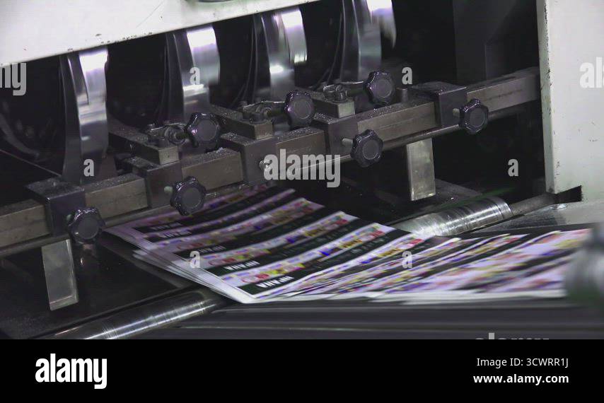 print plant factory, magazine transports on conveyor belt line after ...
