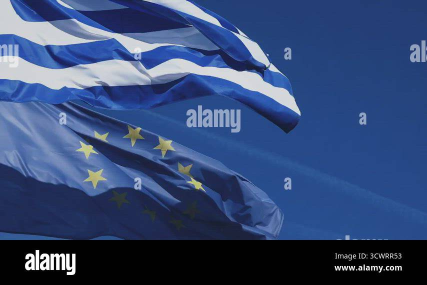 Greek and European Union flags and blue sky on a windy day, travel and ...