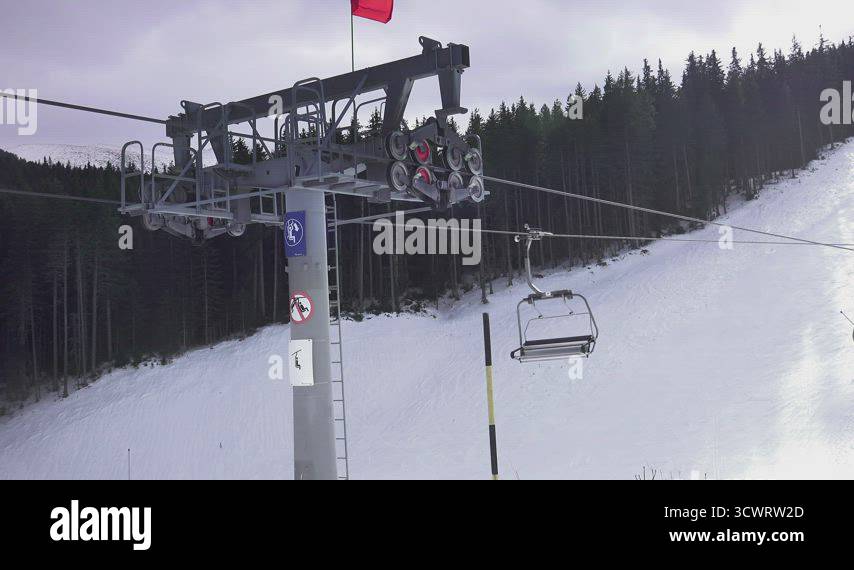BANSKO, BULGARIA - circa FEB, 2016: Ski lift takes Skiers on slope at ...