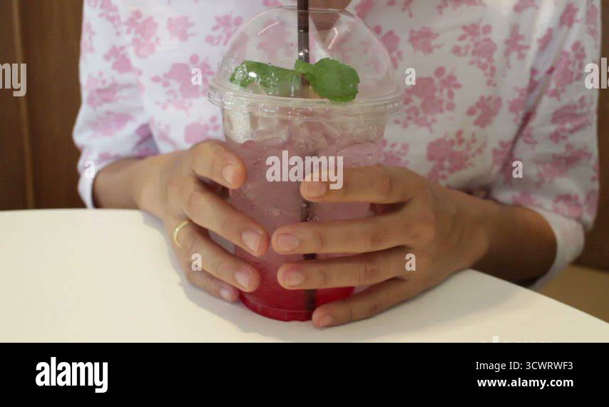 Woman tasting iced mix berry soda Stock Video Footage - Alamy