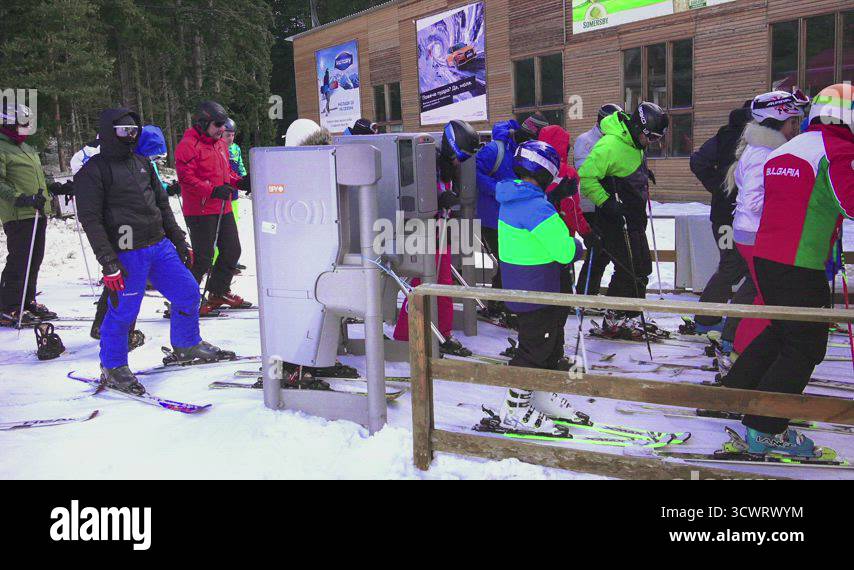 BANSKO, BULGARIA - circa FEB, 2016: Ski lift Queue line and Skiers at ...
