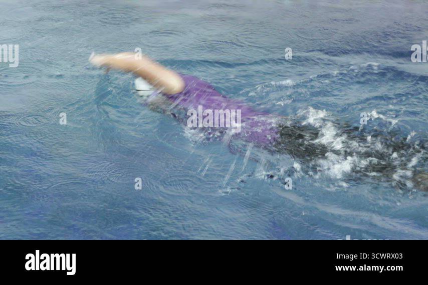 Woman freestyle diving in swimming pool Stock Video Footage - Alamy