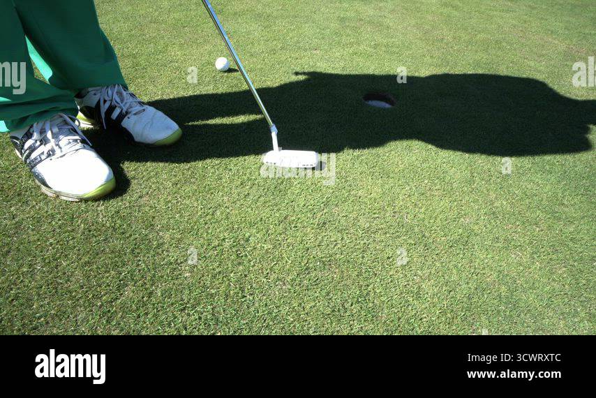 BANSKO, BULGARIA - circa MARCH, 2017: golf ball enter hole at golfing ...