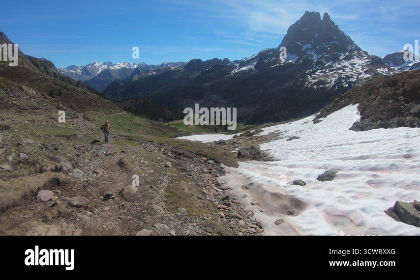 hiker woman walking in the french Pyrenees mountains, Pic du midi d ...