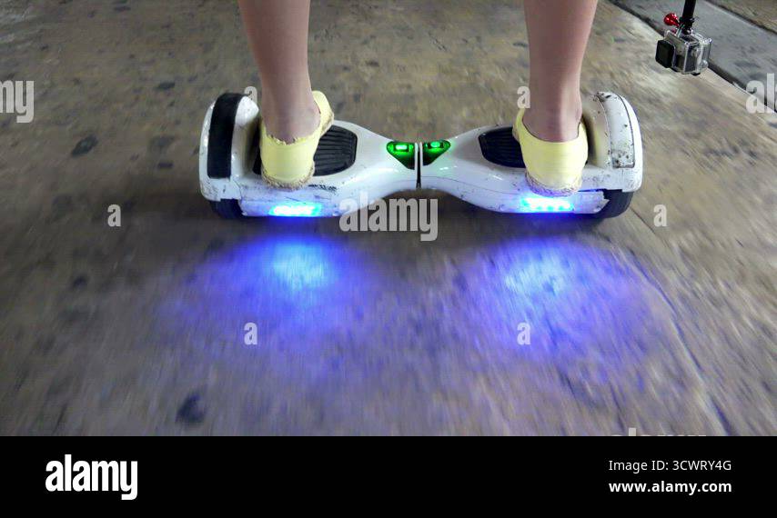 Girl feet on the hover board POV. Mini segway Stock Video Footage - Alamy