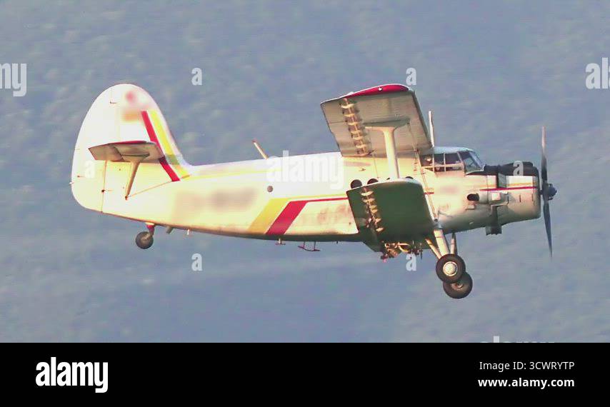 A crop dusting plane working over a field Stock Video Footage - Alamy
