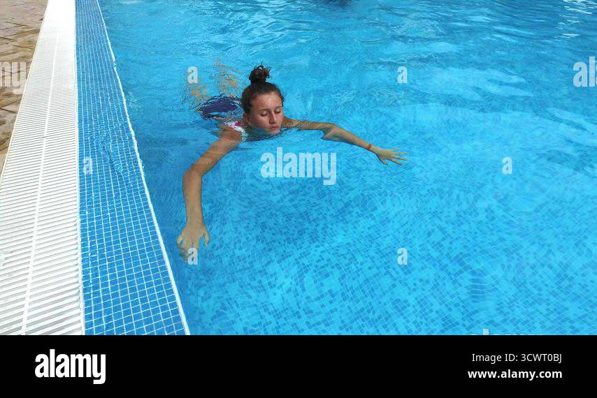 Front view of a girl in the swimming pool, 4k trekking shot Stock Video ...