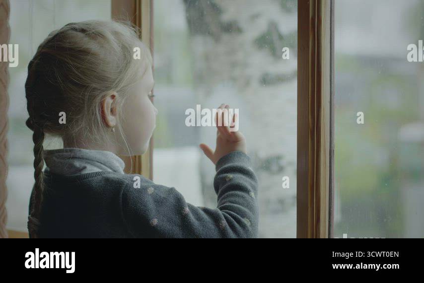 Girl Drawing With Fingers On Window Stock Video Footage - Alamy