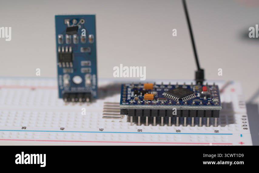 Breadboard prototyping with microcontroller arduino components and wire jumpers Stock Video ...