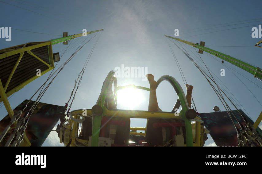 Bungee ball released against sun. Amusement park extreme ride Stock ...