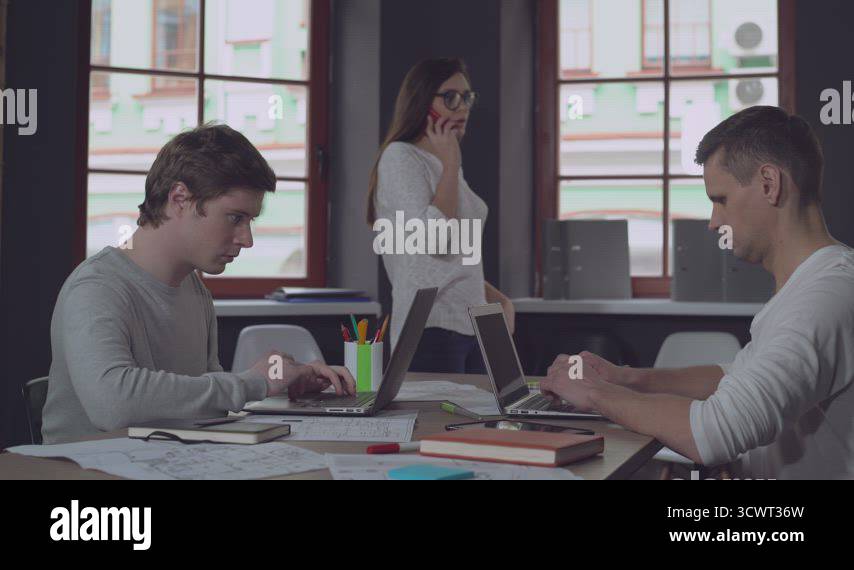 Colleagues working at the project at work Stock Video Footage - Alamy