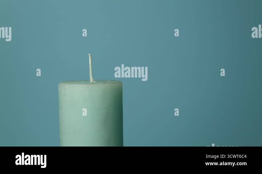 Light blue candle trembling flame Stock Video Footage - Alamy