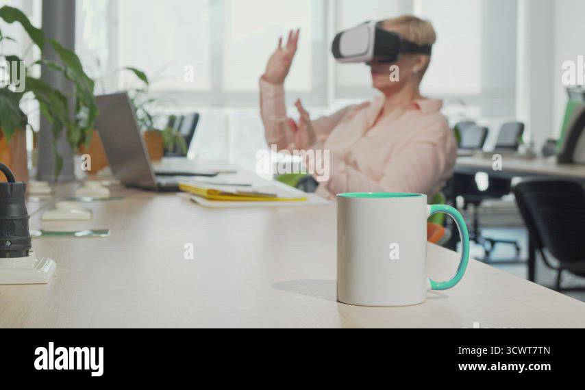 Female entrepreneur using 3d virtual reality goggles at the office ...