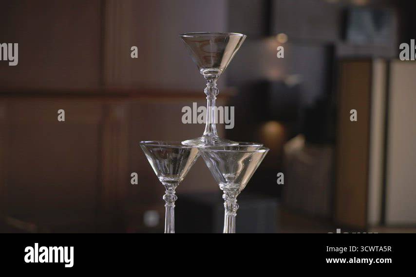 Pyramid tower of glasses with champagne. Sparkling alcohol wine at the ...