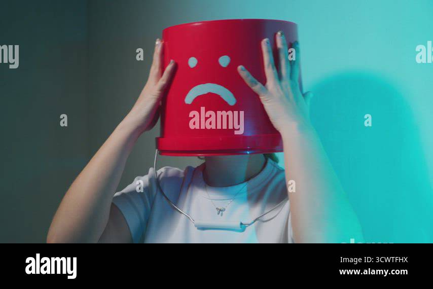 Worker in uniform with red bucket on his head sad Stock Video Footage - Alamy