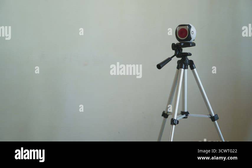 Laser Level measuring tool with visible red laser beam crossing Stock ...