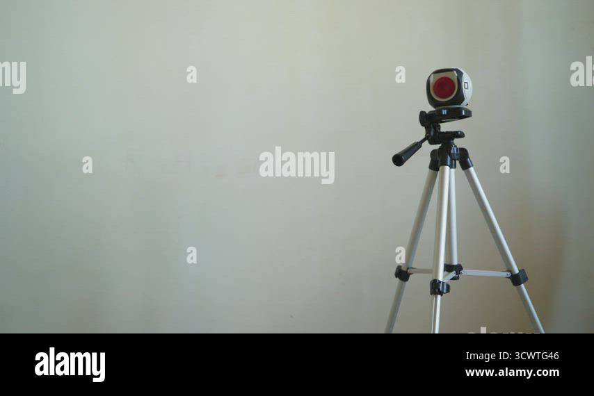 Laser Level measuring tool with visible red laser beam crossing Stock ...