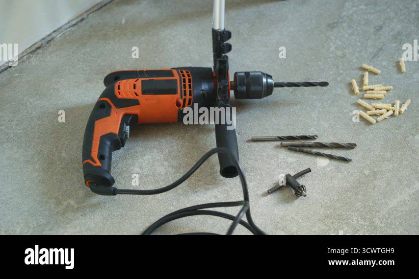 Work tools - electric drill, laser level, box with instruments and ...