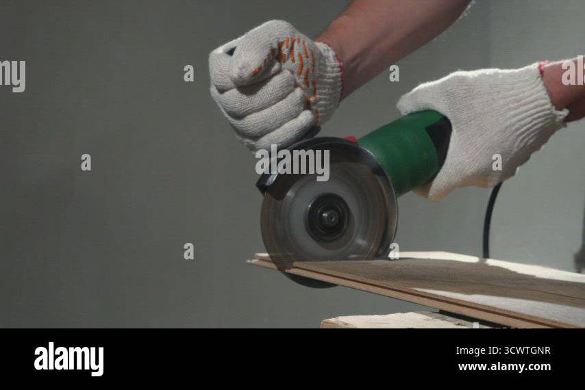 Contractor Using Circular Saw Cutting of New Laminate Flooring ...