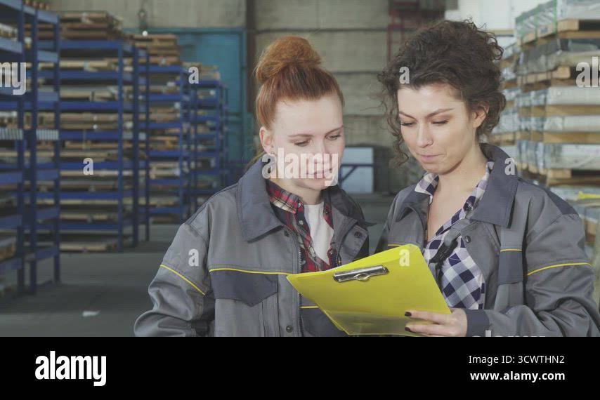 Two female warehouse workers examining Stock Videos & Footage - HD and ...