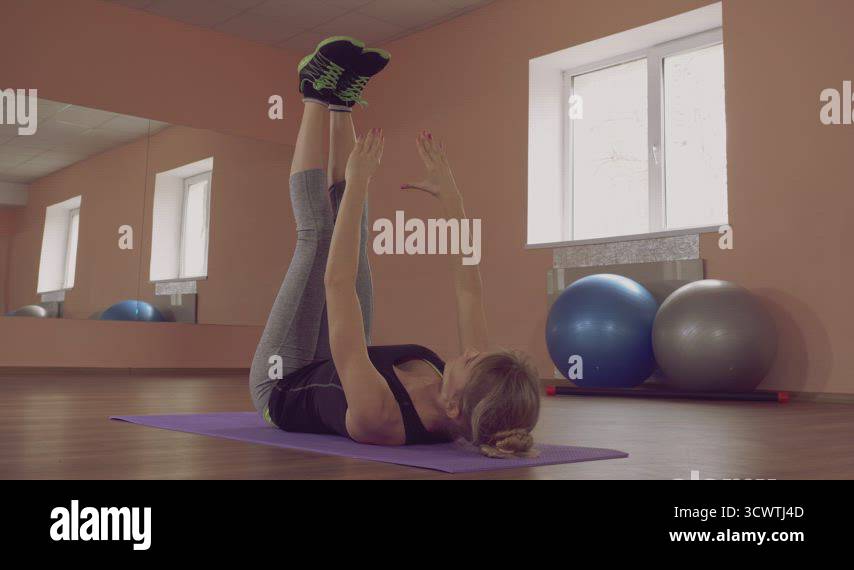 beautiful female intense physical exercise for strong lower abs Stock ...