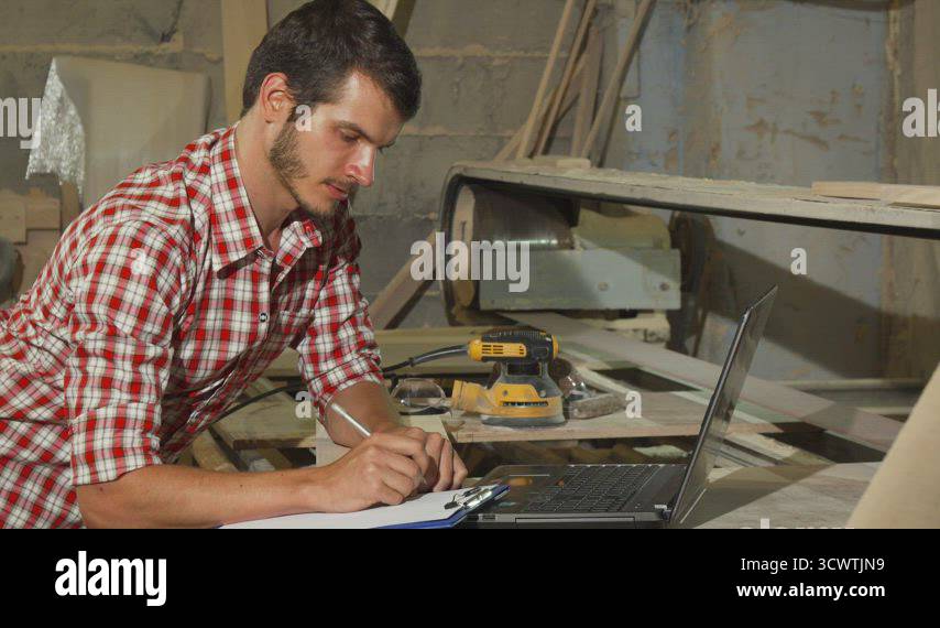 Handsome male carpenter smiling to the camera at his workshop Stock ...