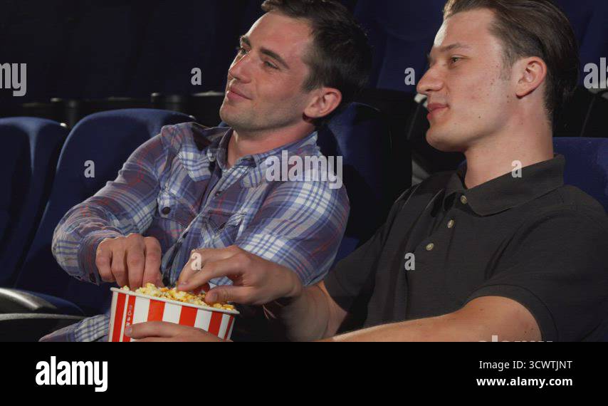 Male friends eating popcorn laughing Stock Videos & Footage - HD and 4K ...