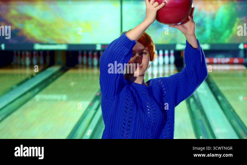 Girl spins with bowling ball in her hands Stock Video Footage - Alamy