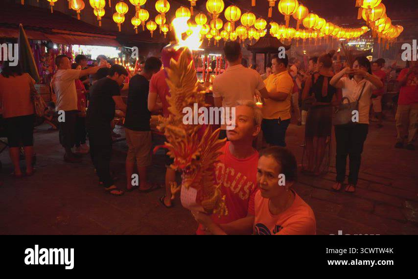 Devotees pray with large dragon incense stick to deities Stock Video ...