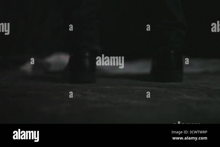 Human walking down the stairs with a wooden stick in his hands Stock ...