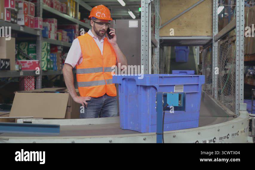 Worker talking about logistic by cell Stock Video Footage - Alamy