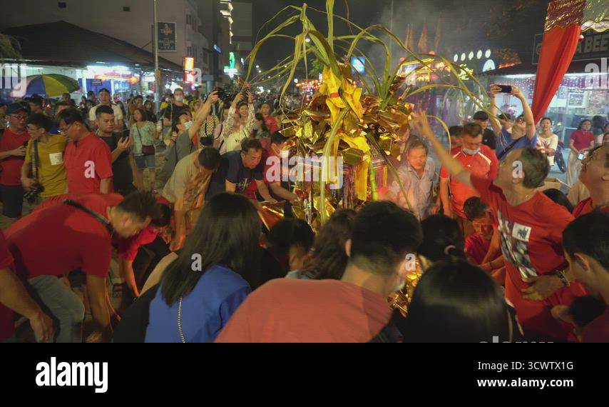 Chinese burn joss paper during Hokkien Chinese New Year at Chew Jetty ...