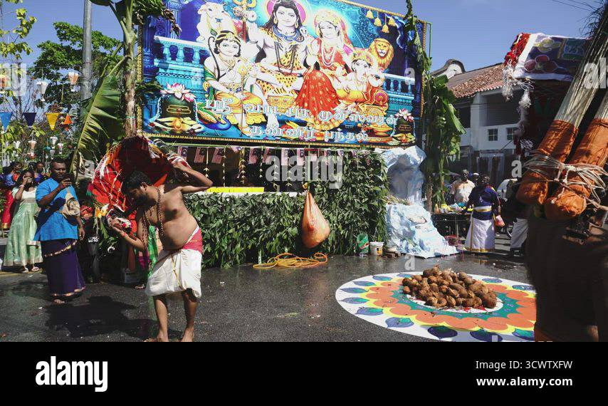 Slowly reveal the environment at Thaneer Panthal with kavadi bearer ...