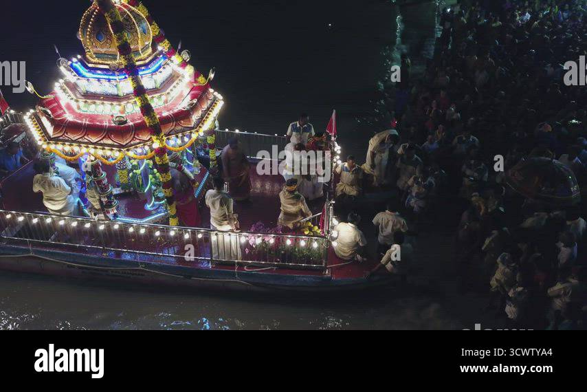 Offering to the deity Sri Singamuga Kaliamman during floating chariot ...
