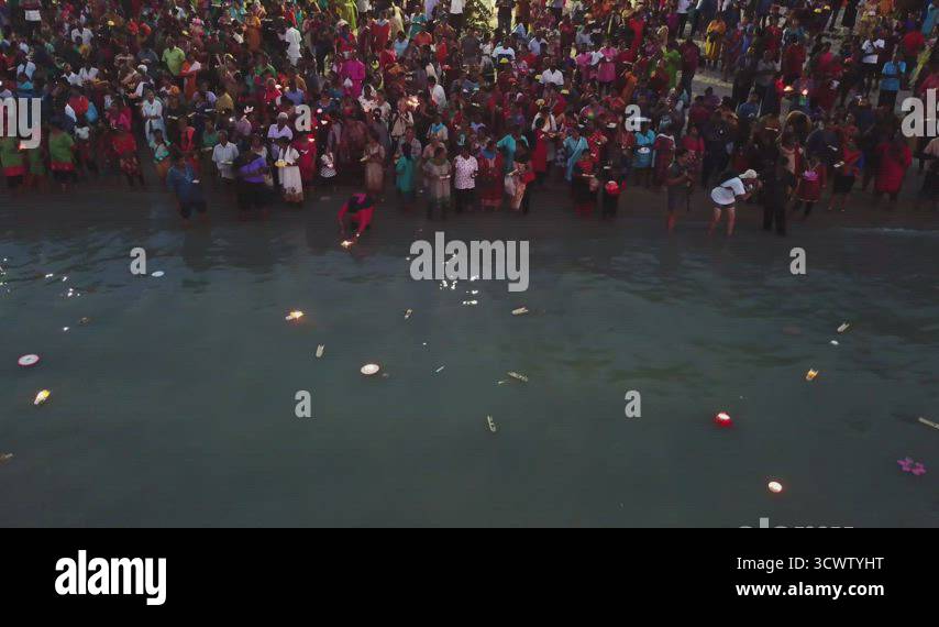 Devotees release candle lit float during floating chariot festival ...