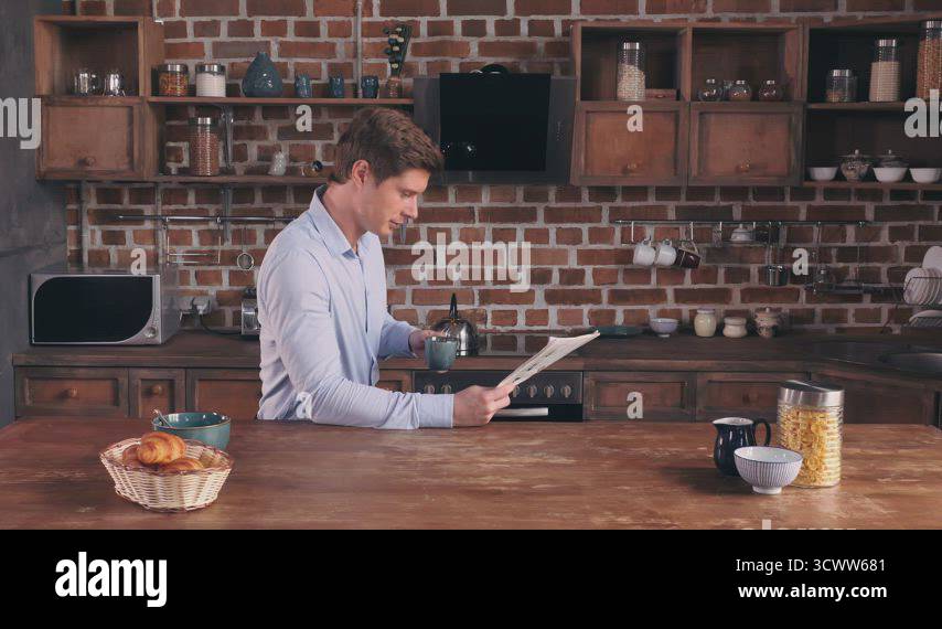 Male checking results of the match in the sports page Stock Video ...