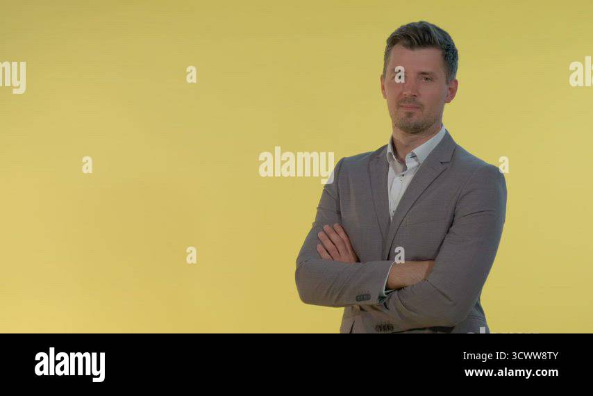 Portrait of handsome man in suit laughing to the camera Stock Video ...