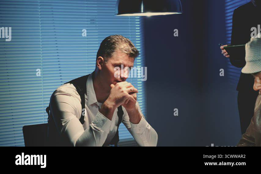 Close-up of police detective is threatened with a weapon during ...