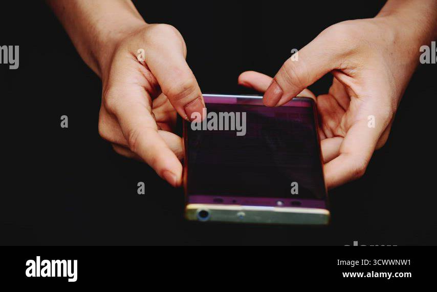 The fingers are texting on mobile phones in the hands of women Stock ...