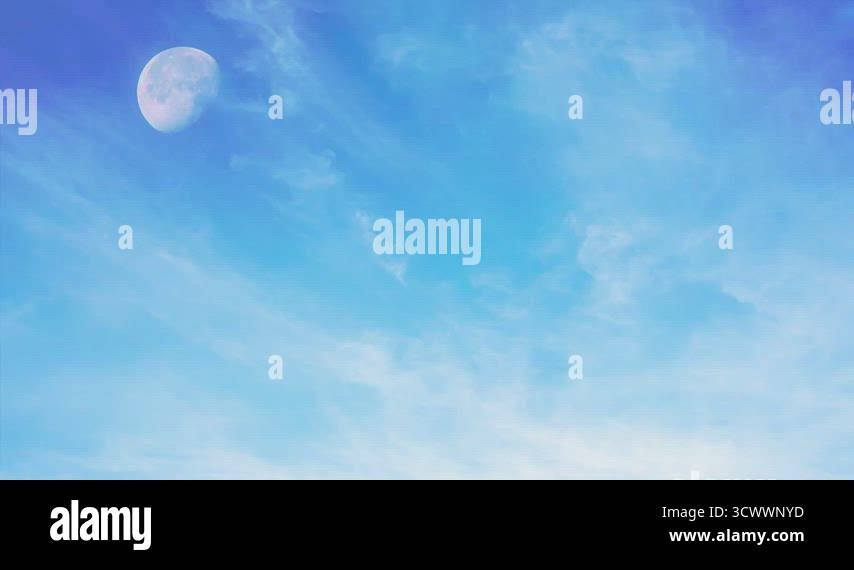 Full moon In the morning moving fast In a bright sky and cloud moving ...