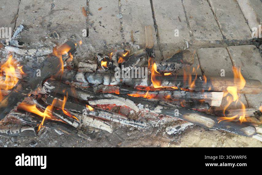 Boiling goulash in deep enameOpen fire is burning in the grill for ...