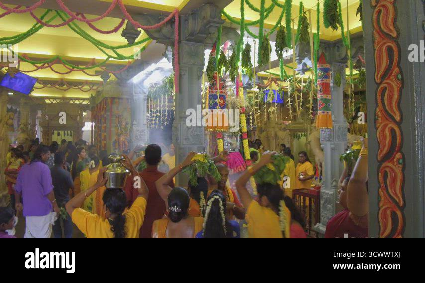 Devotees carry milk pot queue up at Sri Mangalanayagi Amman Devasthanam ...