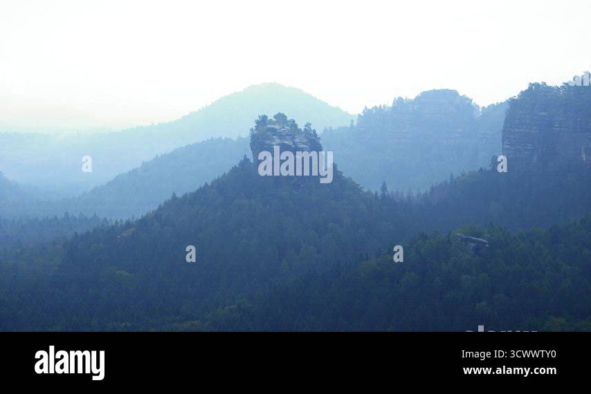 30fps timelapse. Sharp rocks hidden in valley full of heavy mist Spring ...