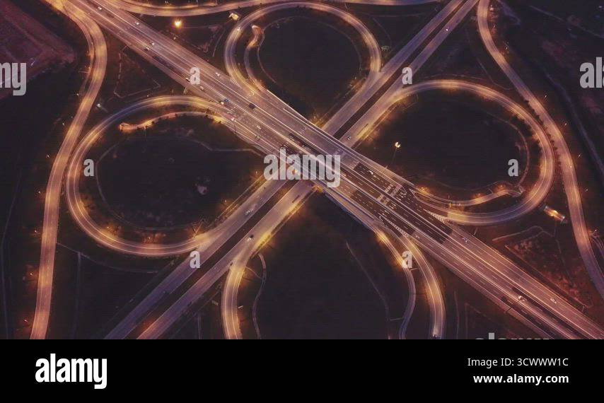 Aerial view clover interchange highway at night Stock Video Footage - Alamy