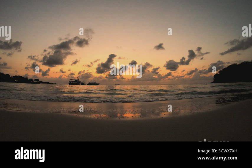 Time lapse motion sea waves that hit the beach and boat Background ...
