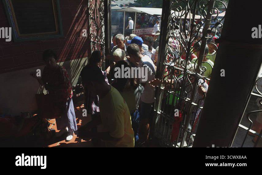 Charity donation of money to poor at Goddess of Mercy temple Stock ...